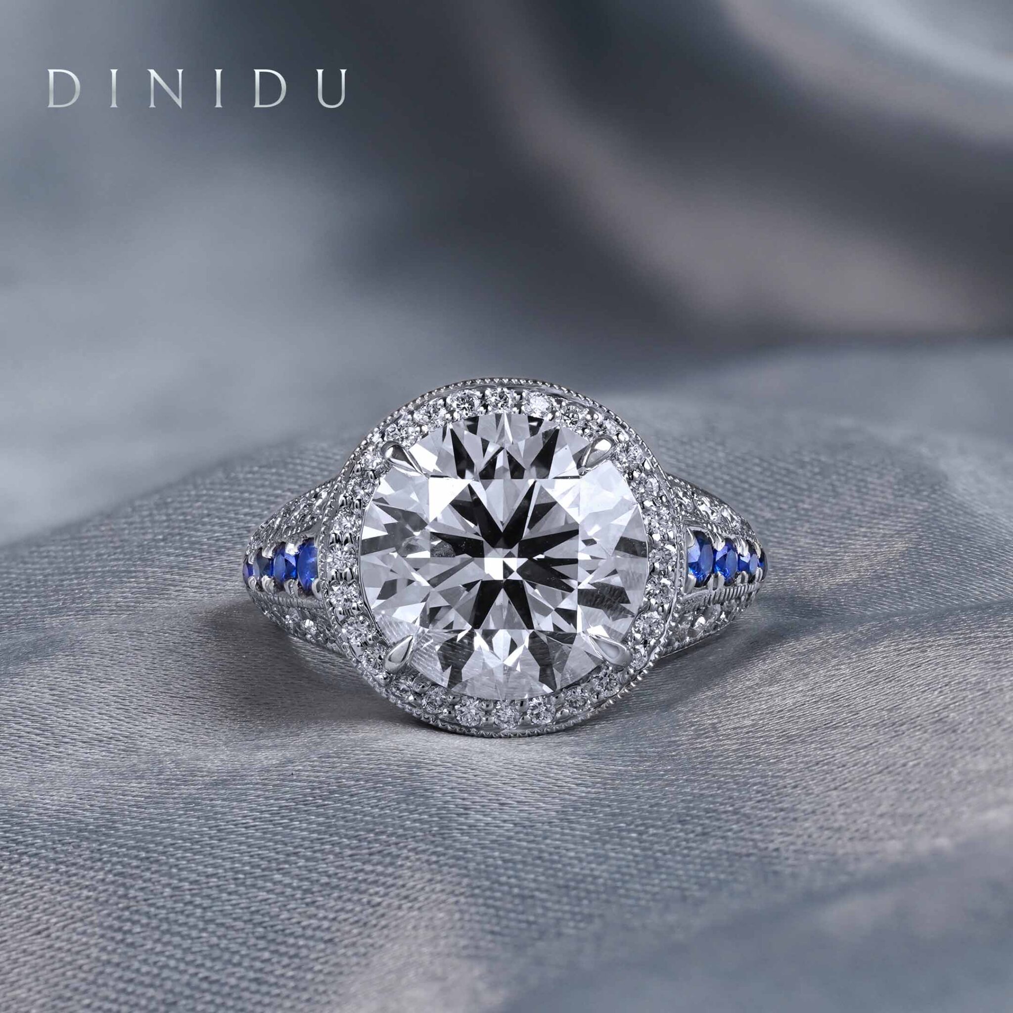 Blue Sapphires and Round Brilliant Diamonds Halo Platinum Ring - DINIDU